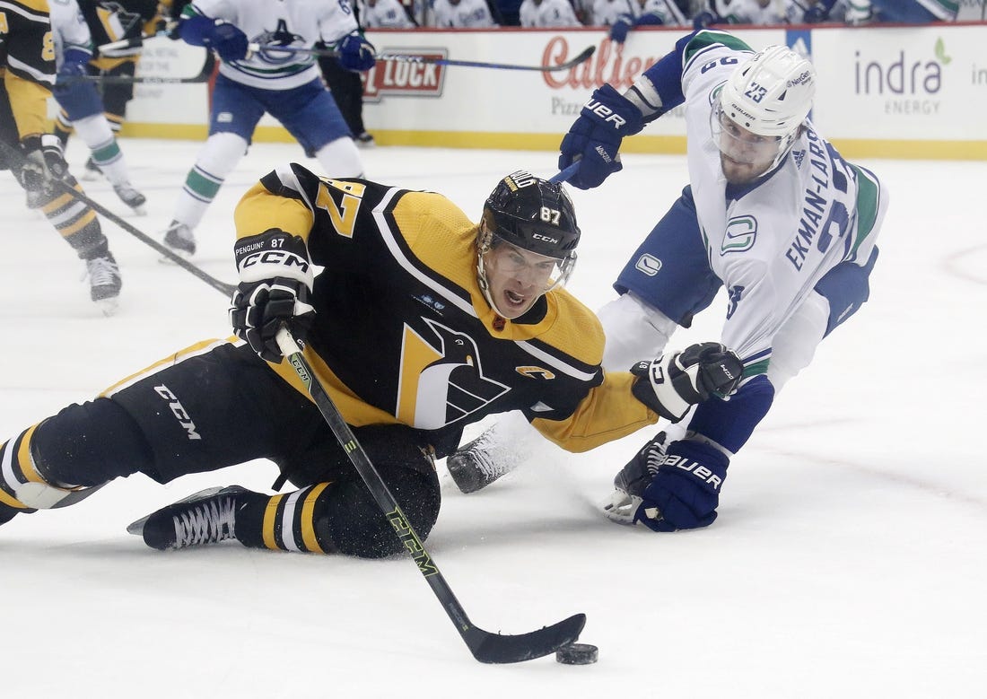 Penguins score five straight to storm past Canucks - Field Level Media ...