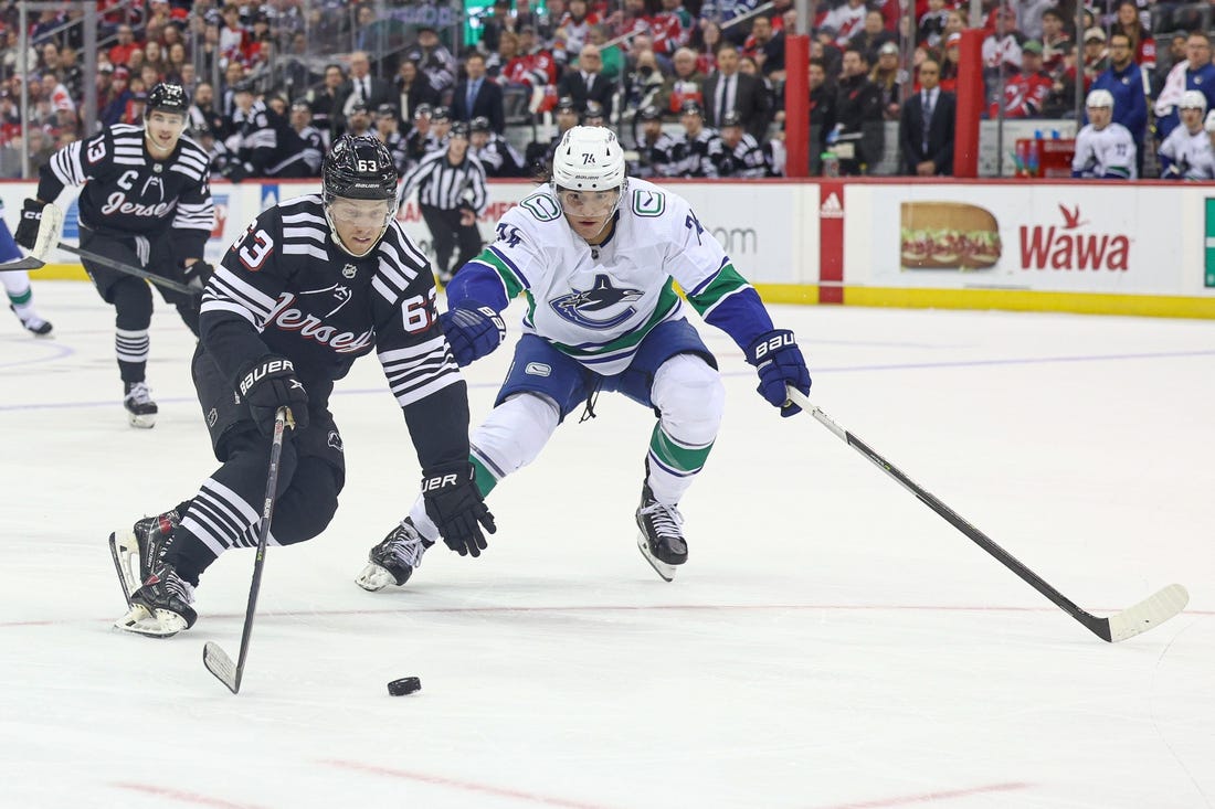 Devils continue OT magic, down Canucks - Field Level Media ...