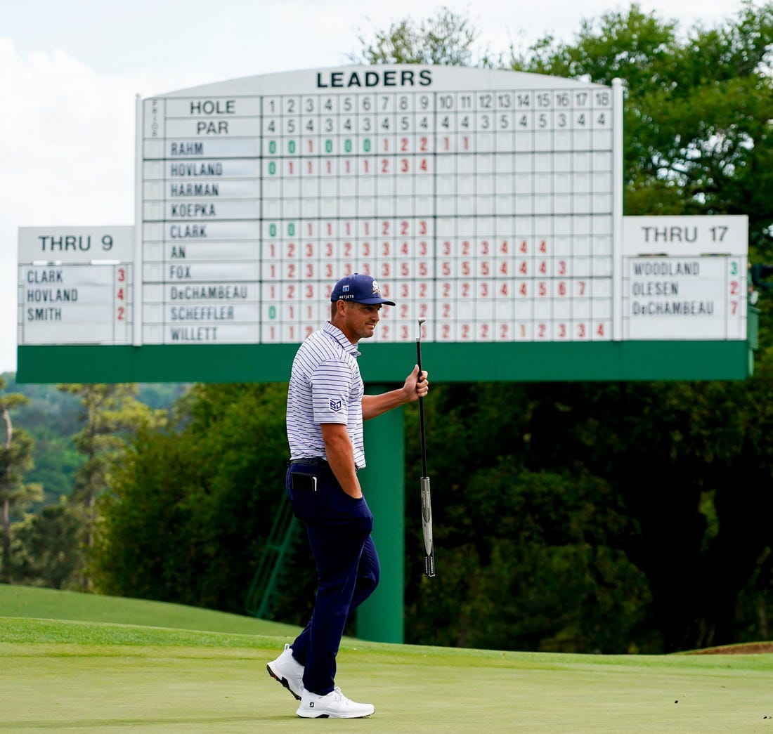 Masters' delayed first round ends with Bryson DeChambeau leading ...