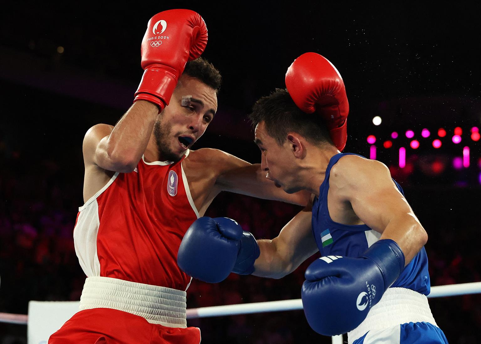 Uzbek boxer Hasanboy Dusmatov beats local favorite for gold - Field ...