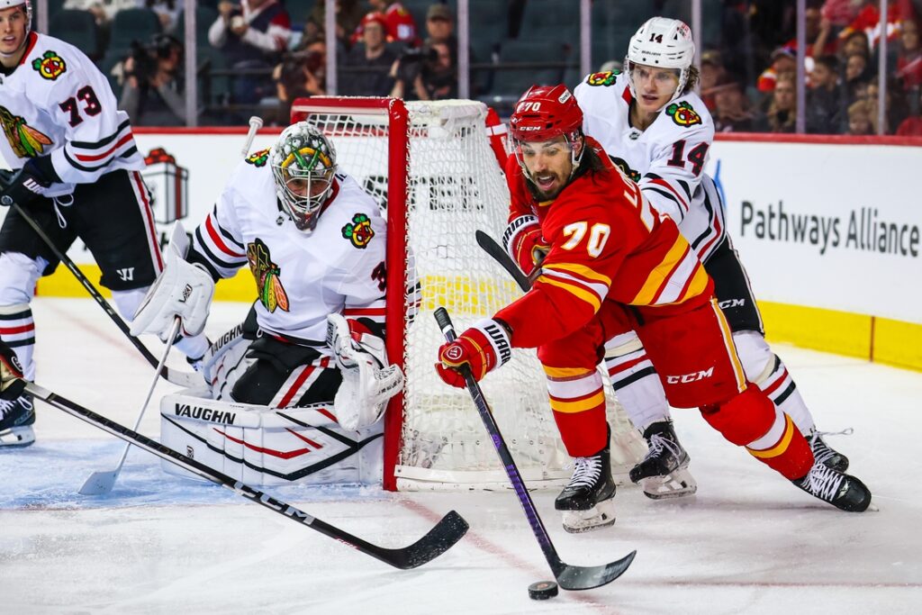 Flames build four-goal lead, hold off late Blackhawks rally - Field ...